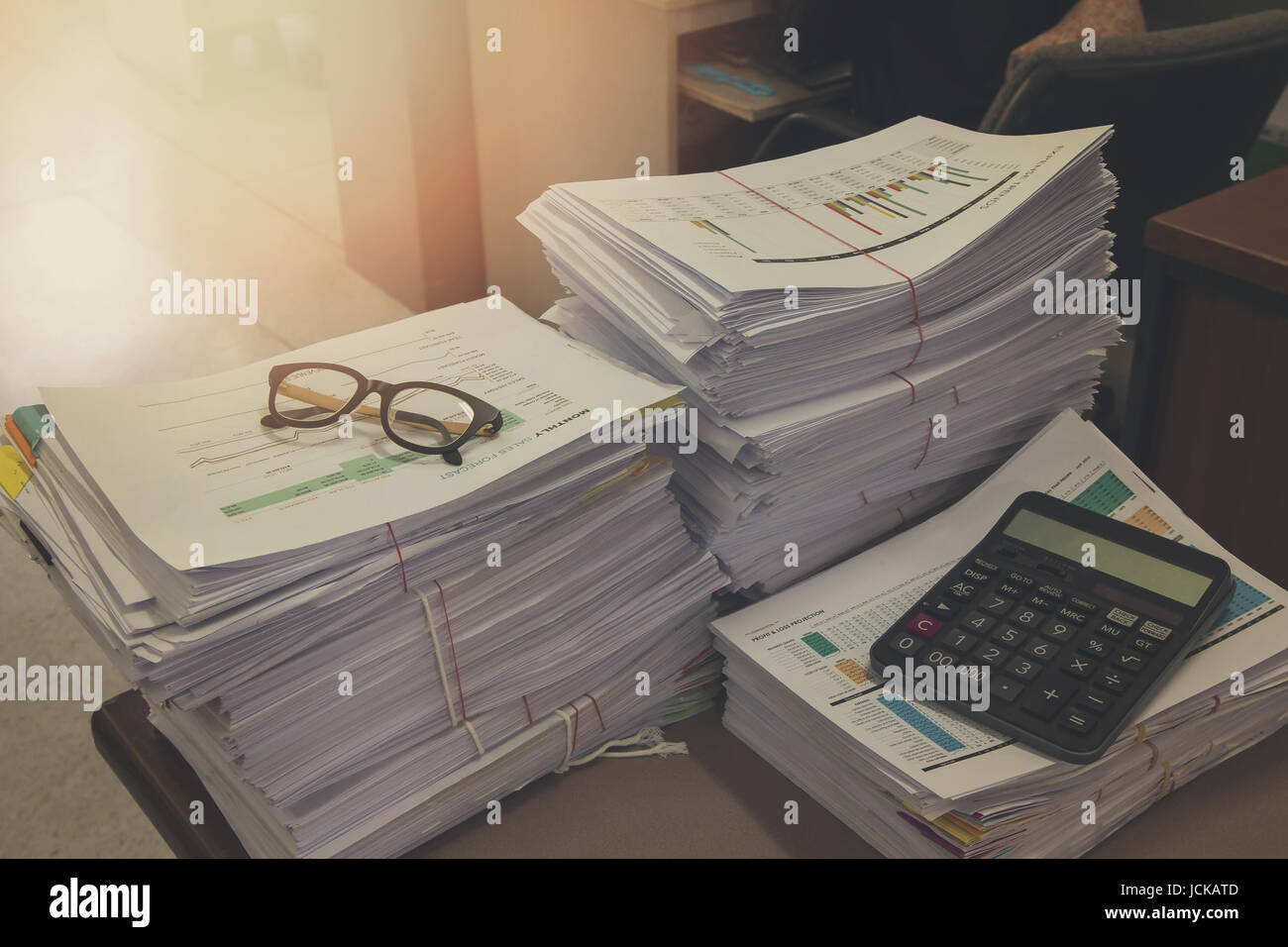 Pile of unfinished documents on office desk, Stack of business paper ...