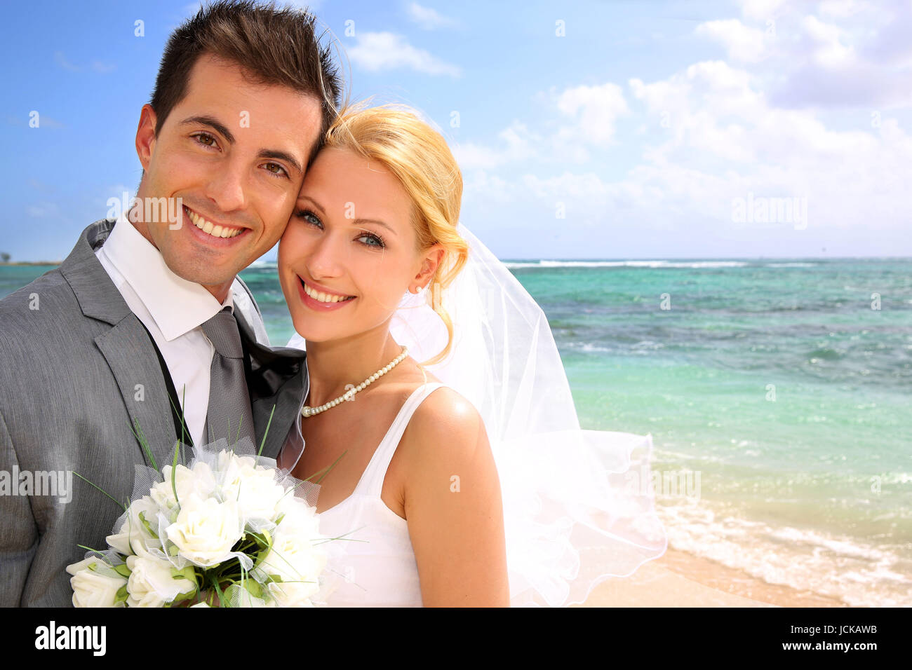 Portrait of beautiful bride and groom at the beach Stock Photo - Alamy