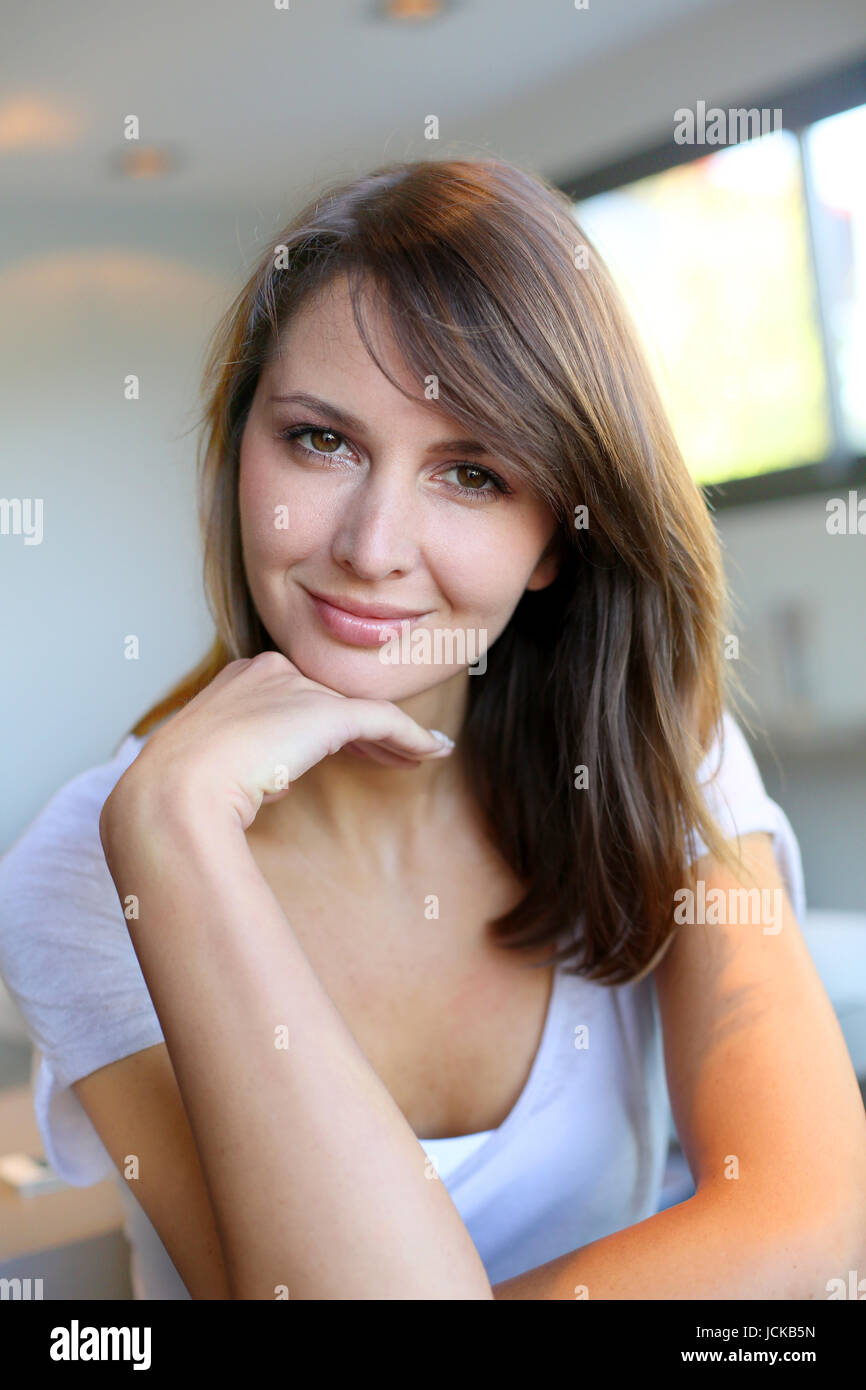 Portrait of beautiful woman looking at camera Stock Photo - Alamy