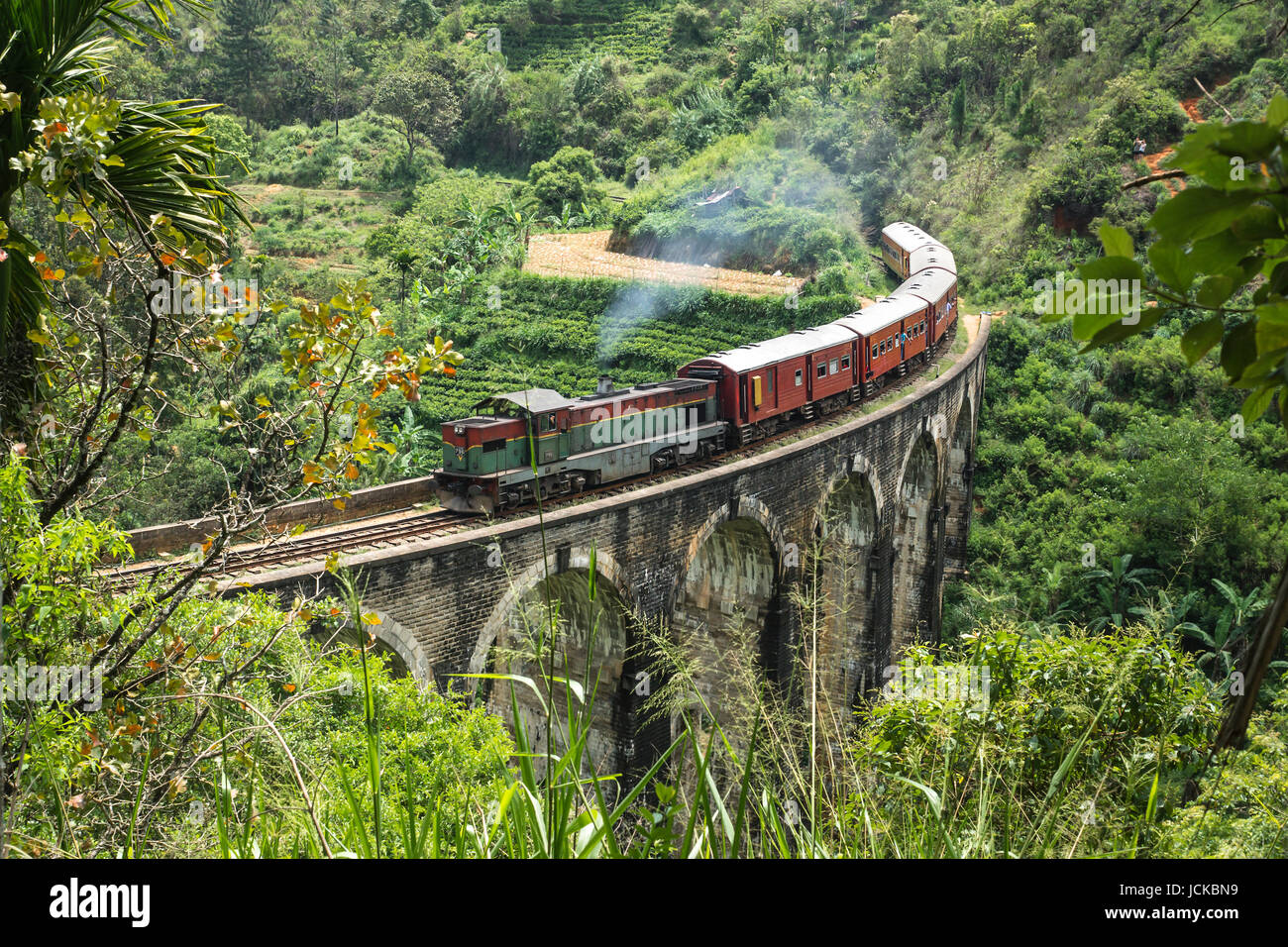 Full train on a nine arch bridge in the mountains of Ella, Sri Lanka ...