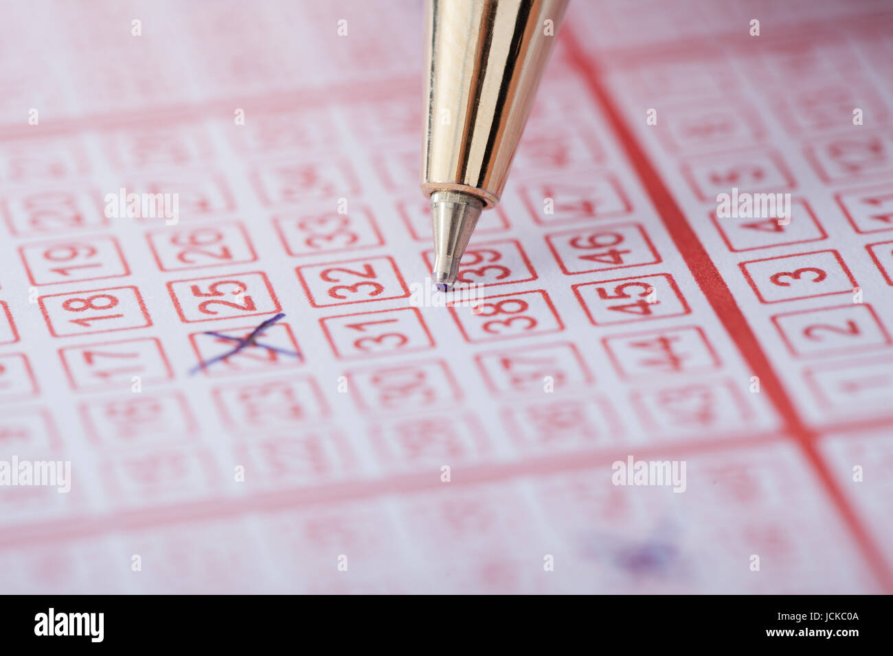 Closeup of pen marking numbers on lottery ticket Stock Photo - Alamy