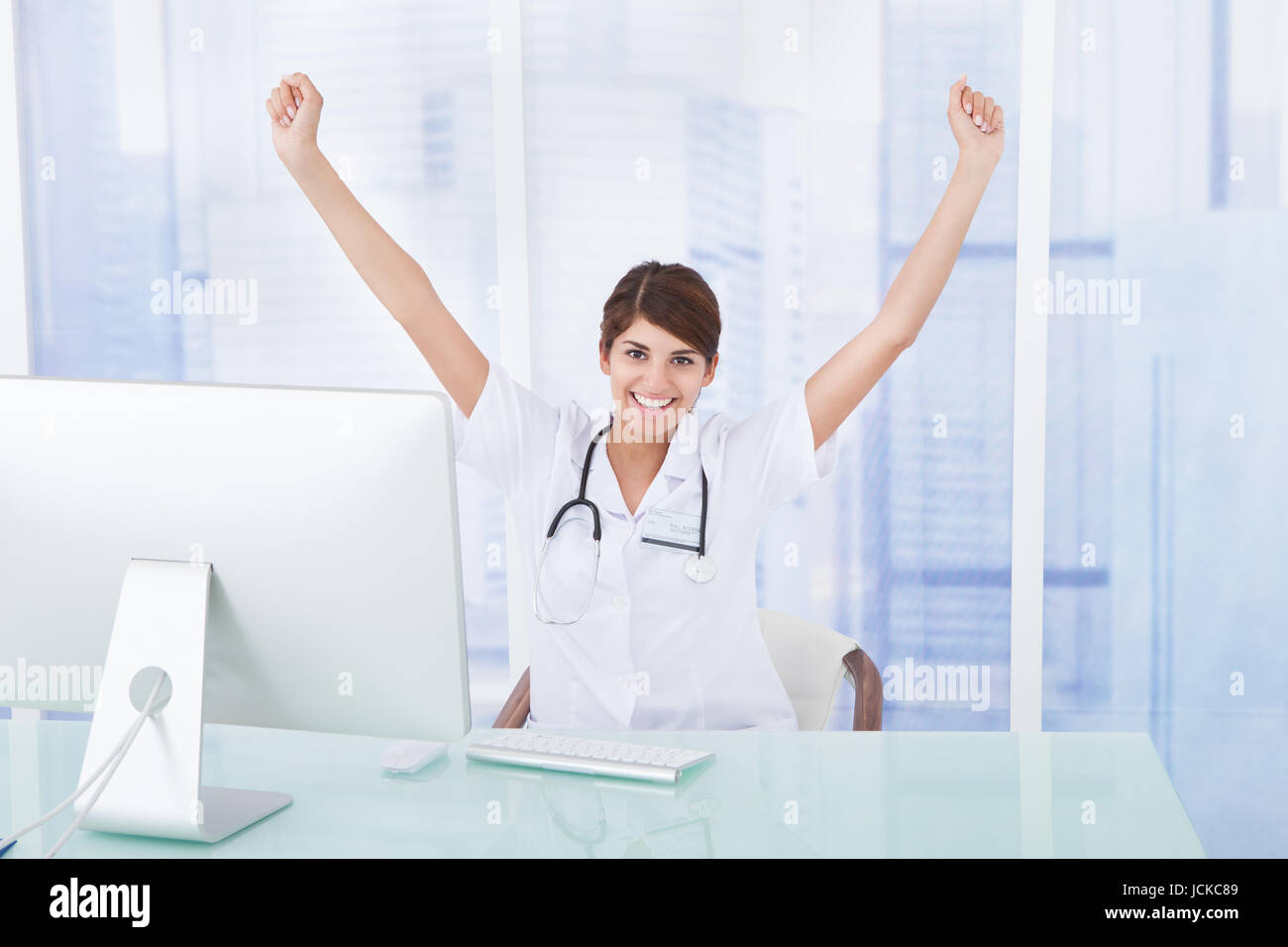 Portrait female doctor celebrating success hi-res stock photography and ...