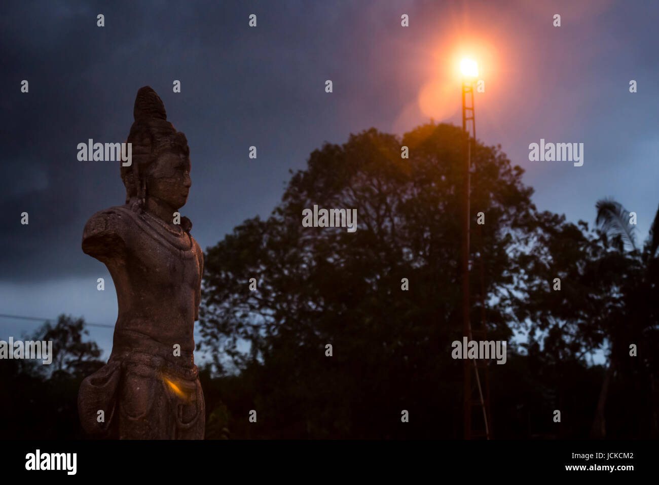 Statue at temple lightned at night Stock Photo - Alamy