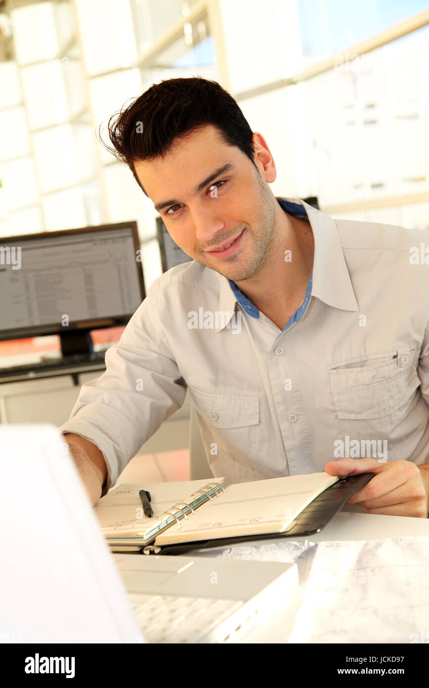 Young man studying at university Stock Photo - Alamy