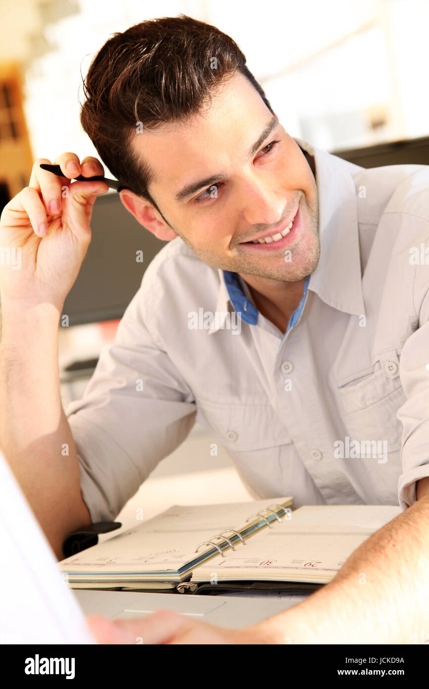 Young man studying at university Stock Photo - Alamy