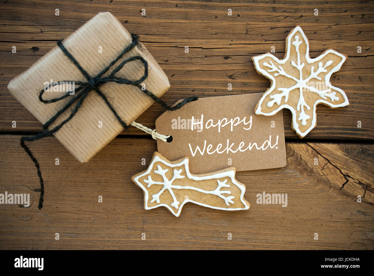 White Happy Weekend on a Label with a Gift and Ginger Bread Cookies, on ...
