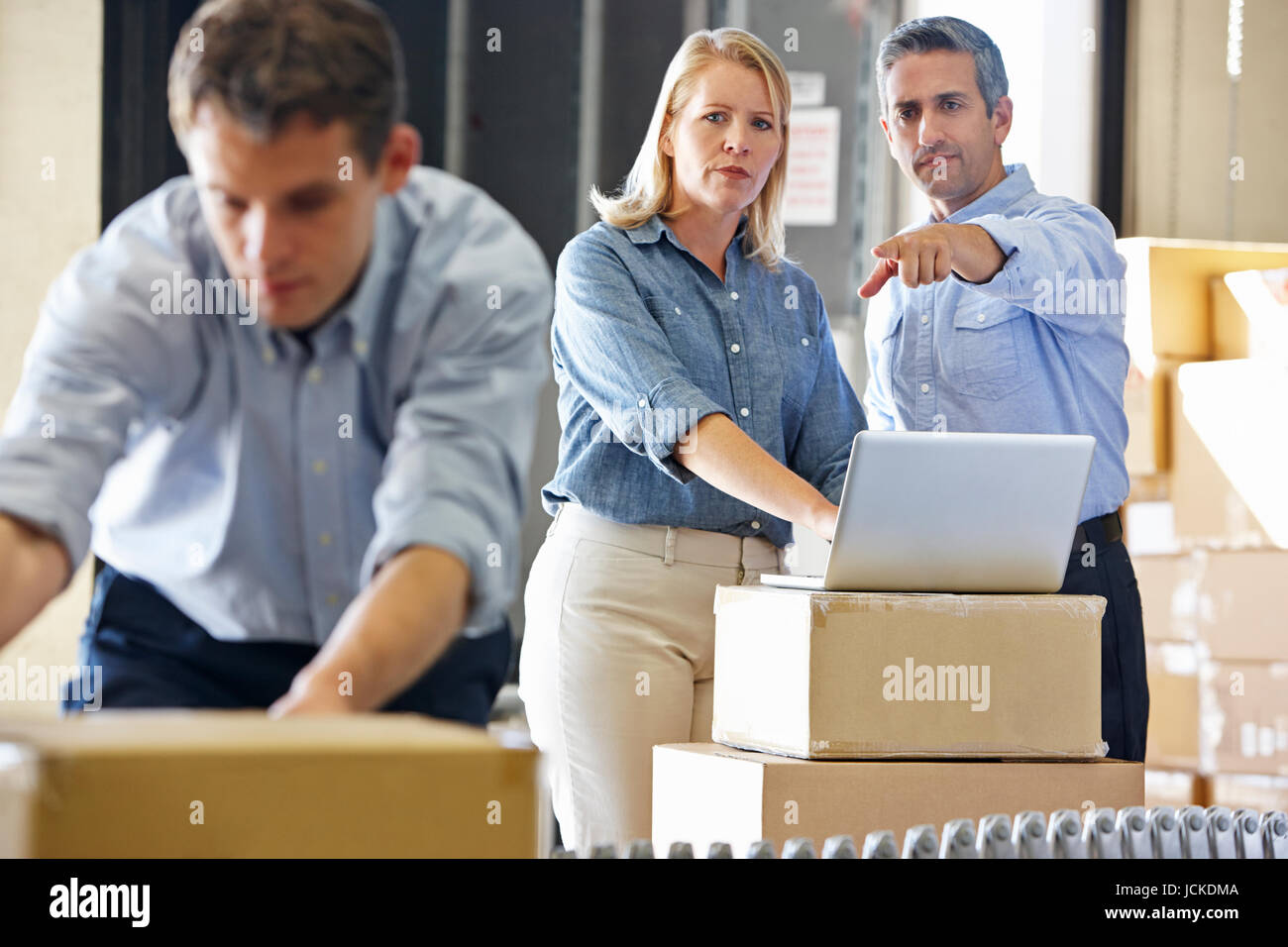 Workers In Distribution Warehouse Stock Photo - Alamy