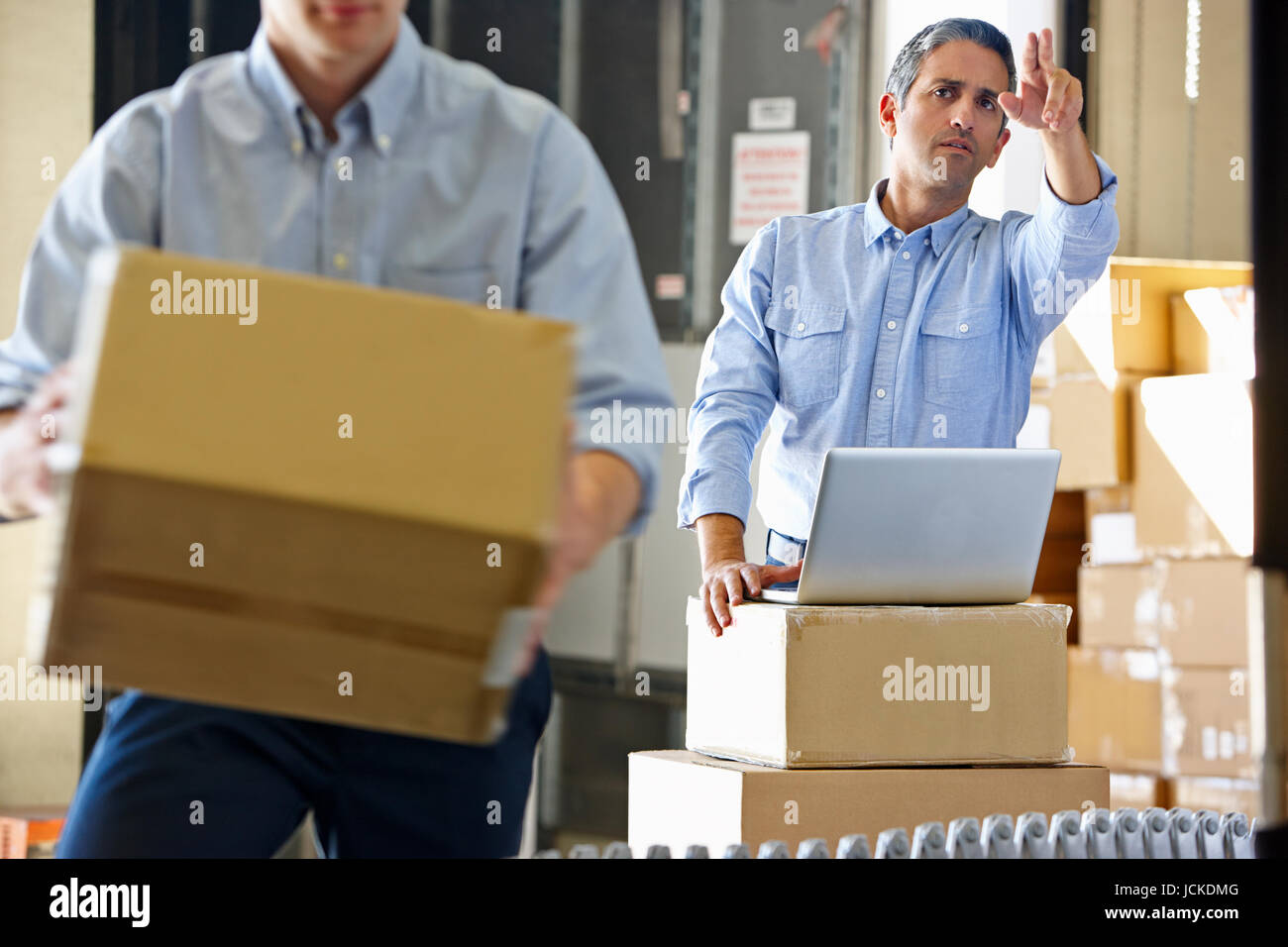 Workers In Distribution Warehouse Stock Photo - Alamy