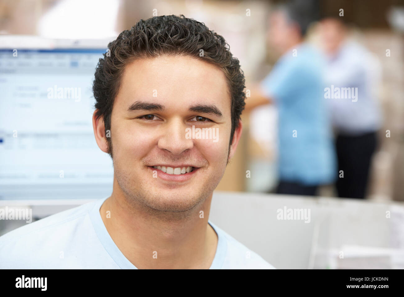 Man At Computer Terminal In Distribution Warehouse Stock Photo - Alamy