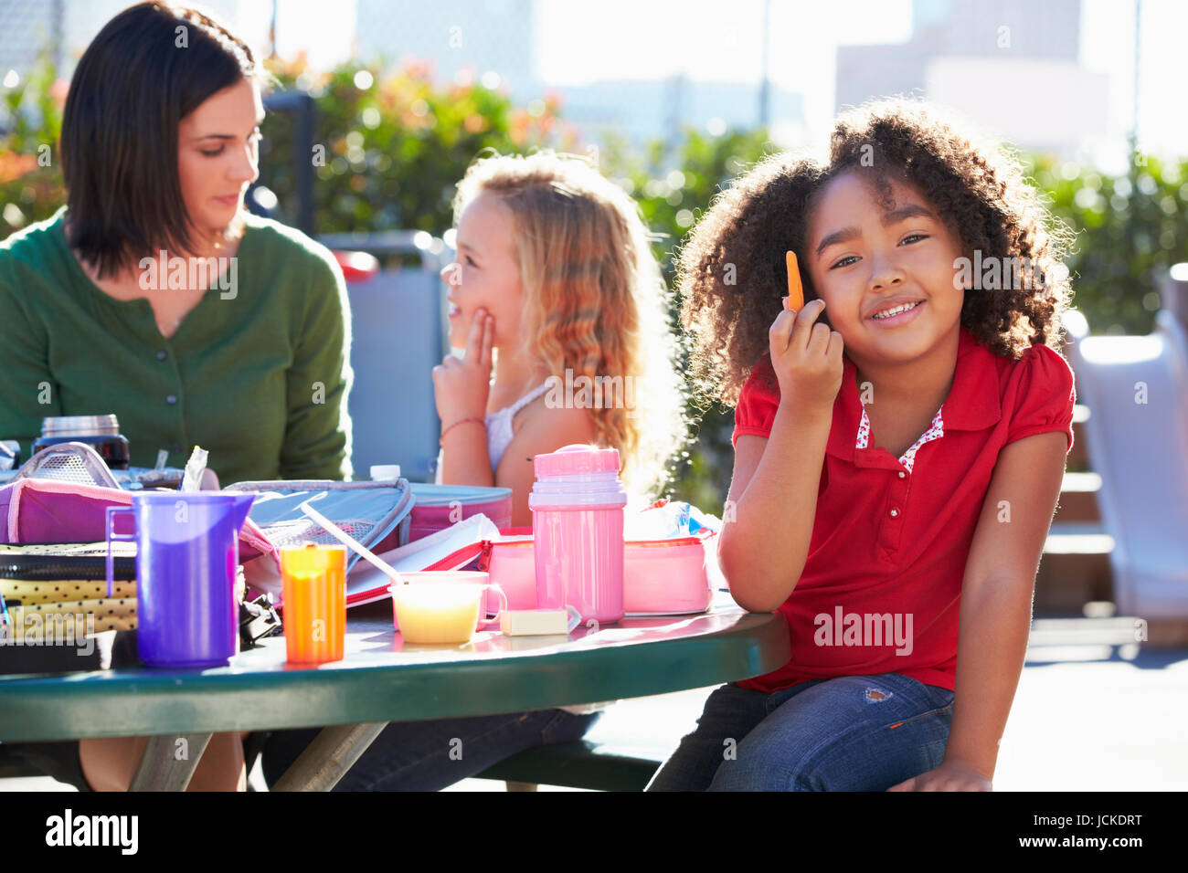 Elementary Pupils And Teacher Eating Lunch Stock Photo - Alamy