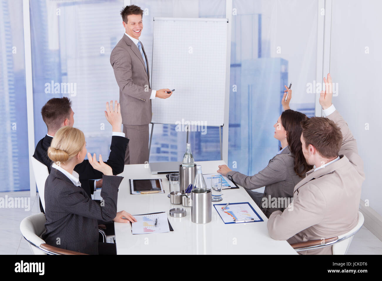 Female raise hand vote seminar hi-res stock photography and images - Alamy
