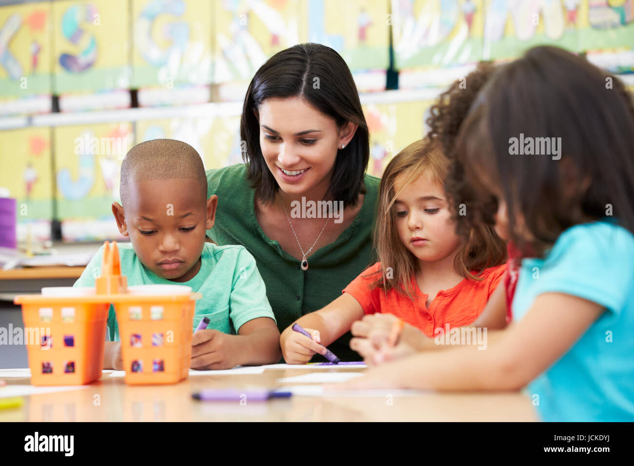 Group Of Elementary Age Children In Art Class With Teacher Stock Photo ...