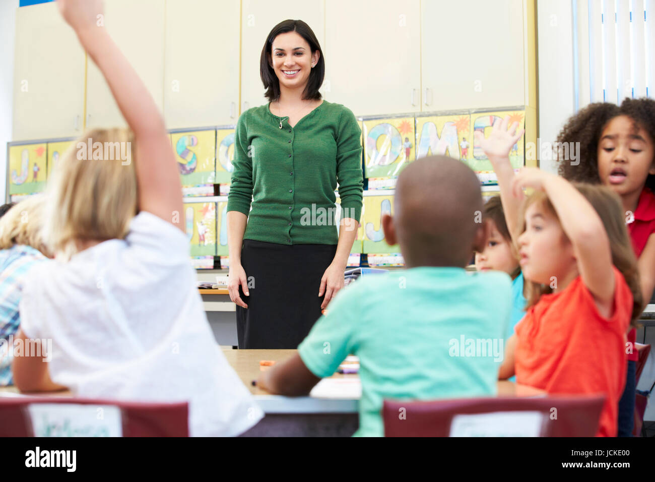 Female preschool teacher talking girl hi-res stock photography and ...