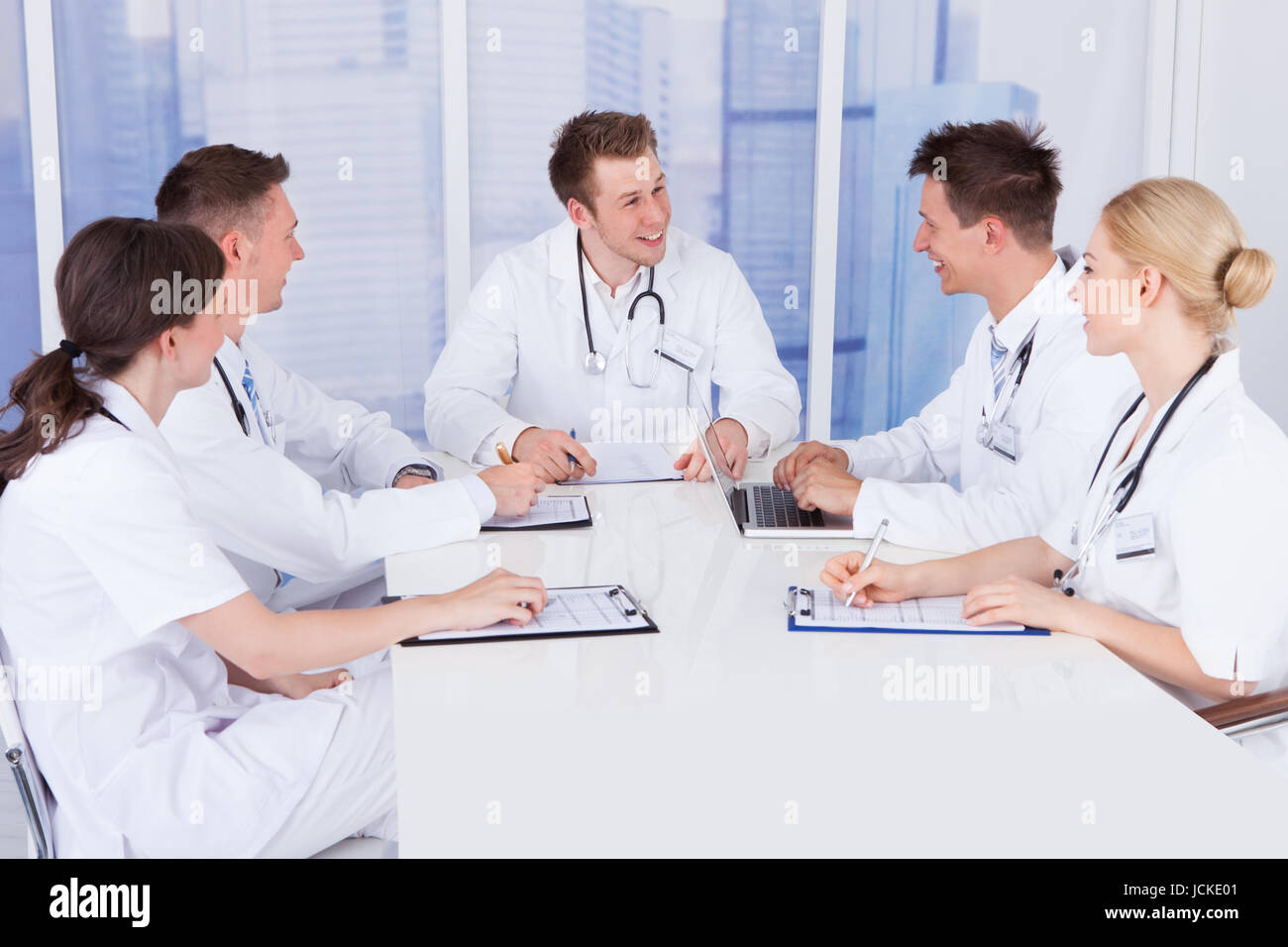 Team of young doctors having conference meeting in hospital Stock Photo ...