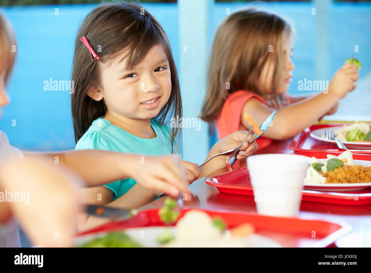 Elementary Pupils Enjoying Healthy Lunch In Cafeteria Stock Photo - Alamy