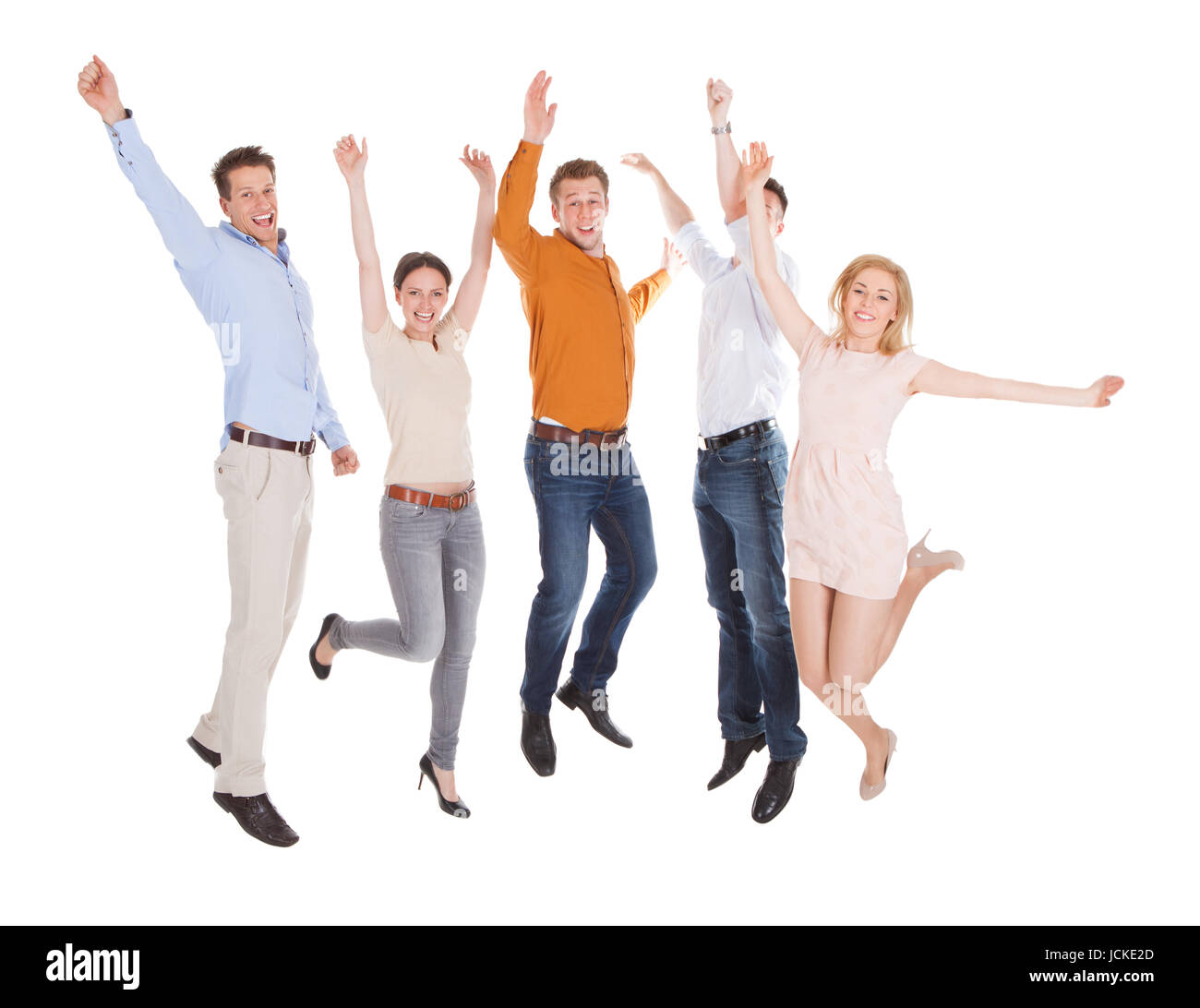 Full length of excited young friends jumping isolated over white ...