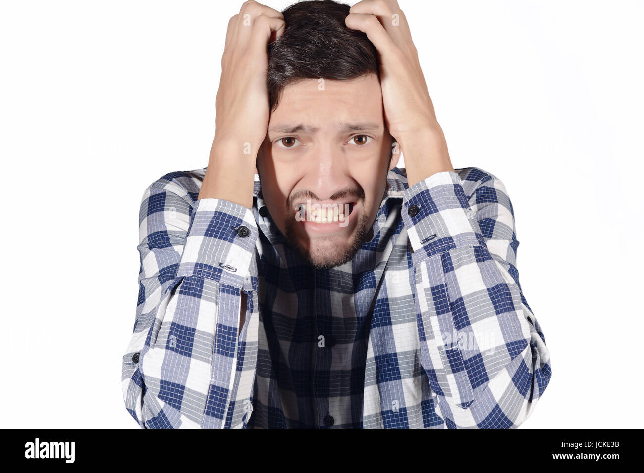Portrait of a young man worried. Isolated white background Stock Photo ...