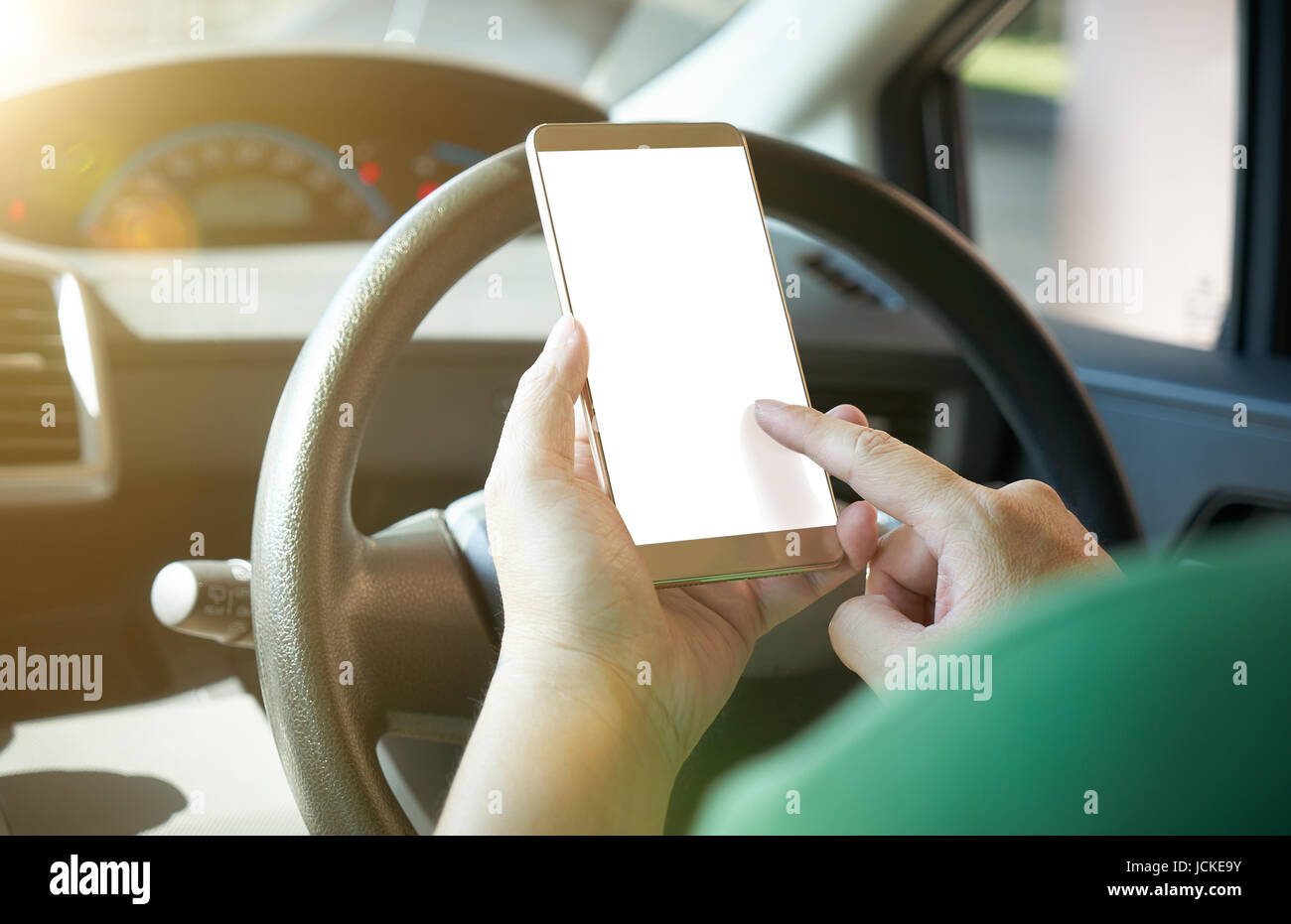 Man driver using smart phone in car during traffic jam , blank white ...