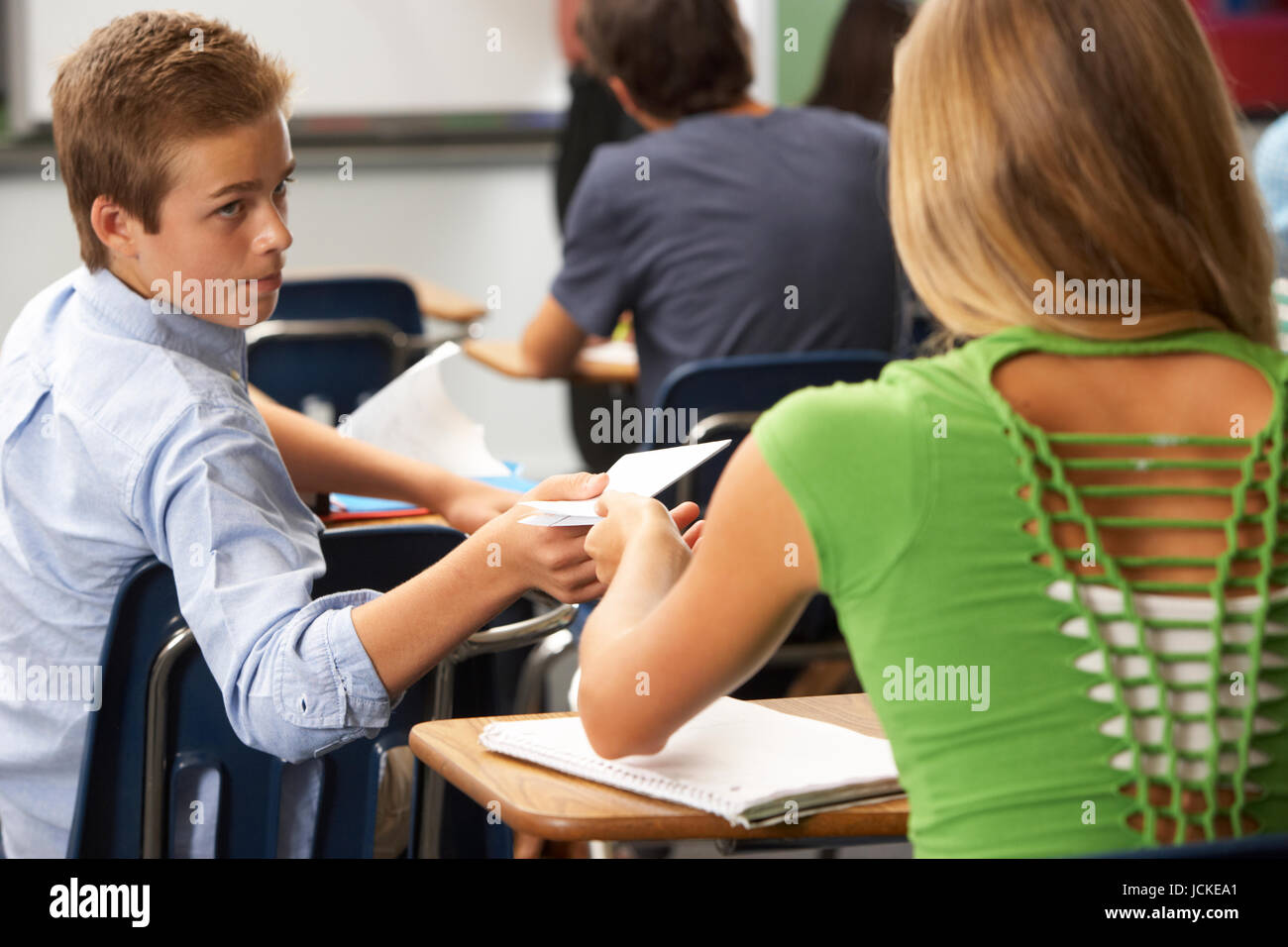 Students Passing Notes In Class Stock Photo - Alamy