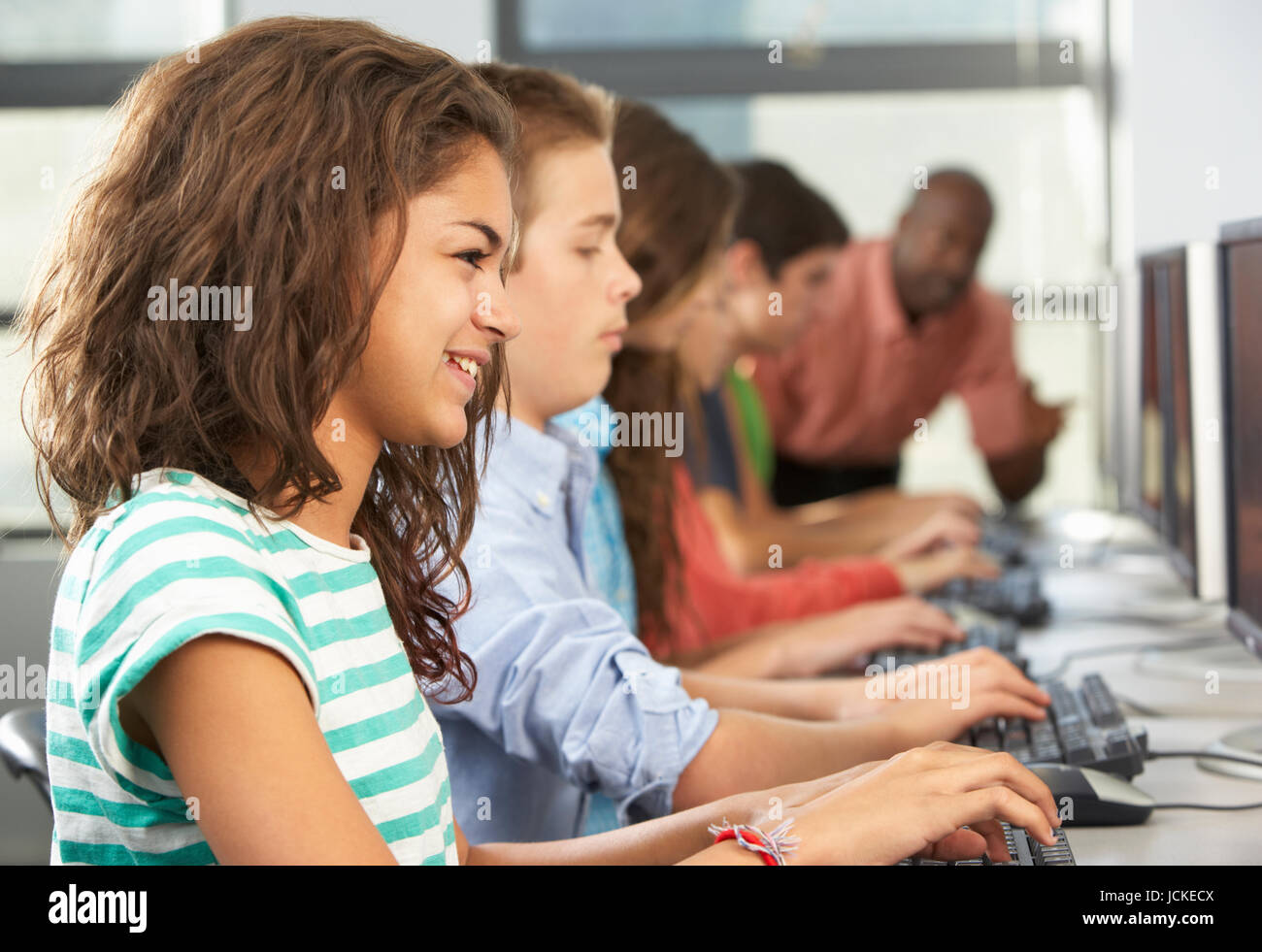 Group Of Students Working At Computers In Classroom Stock Photo - Alamy