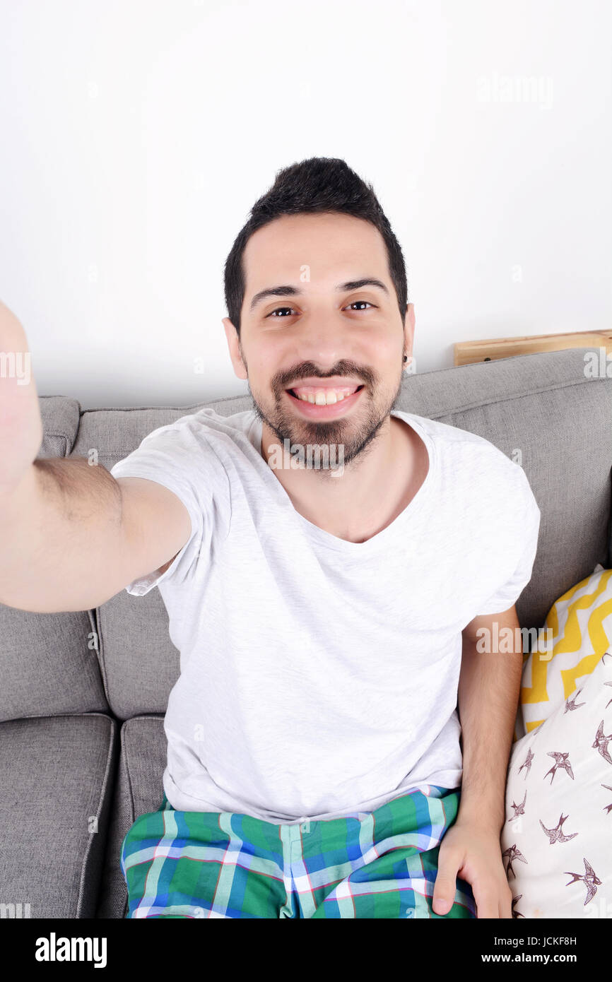 Attractive young man taking selfie. Indoors Stock Photo - Alamy Attractive young man taking selfie. Indoors Stock Photo - Alamy