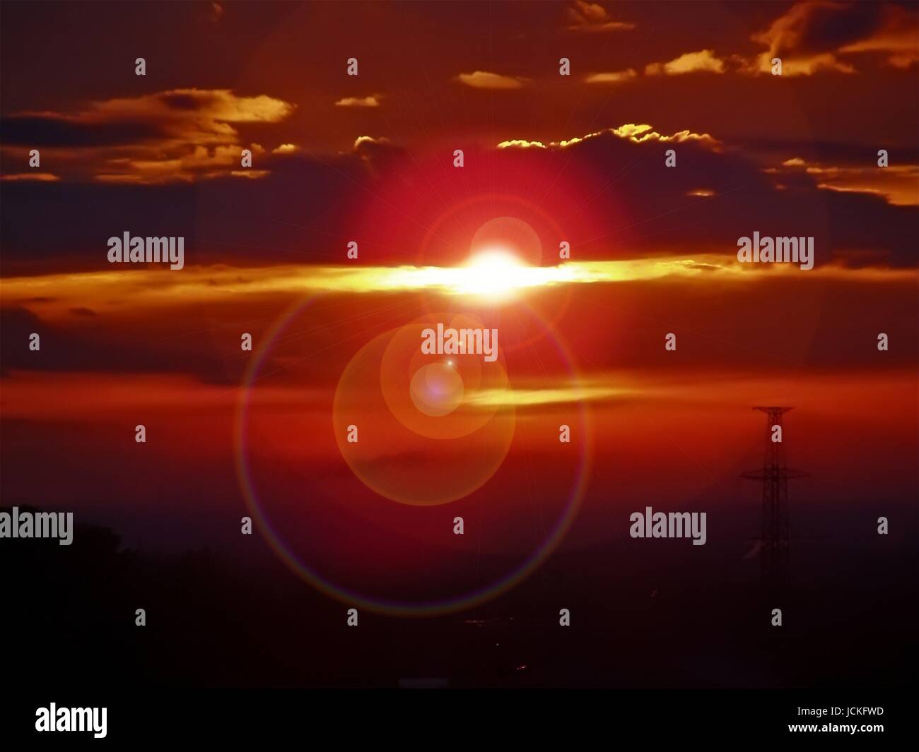 Amazing sunset orange sun in the clouds Stock Photo - Alamy