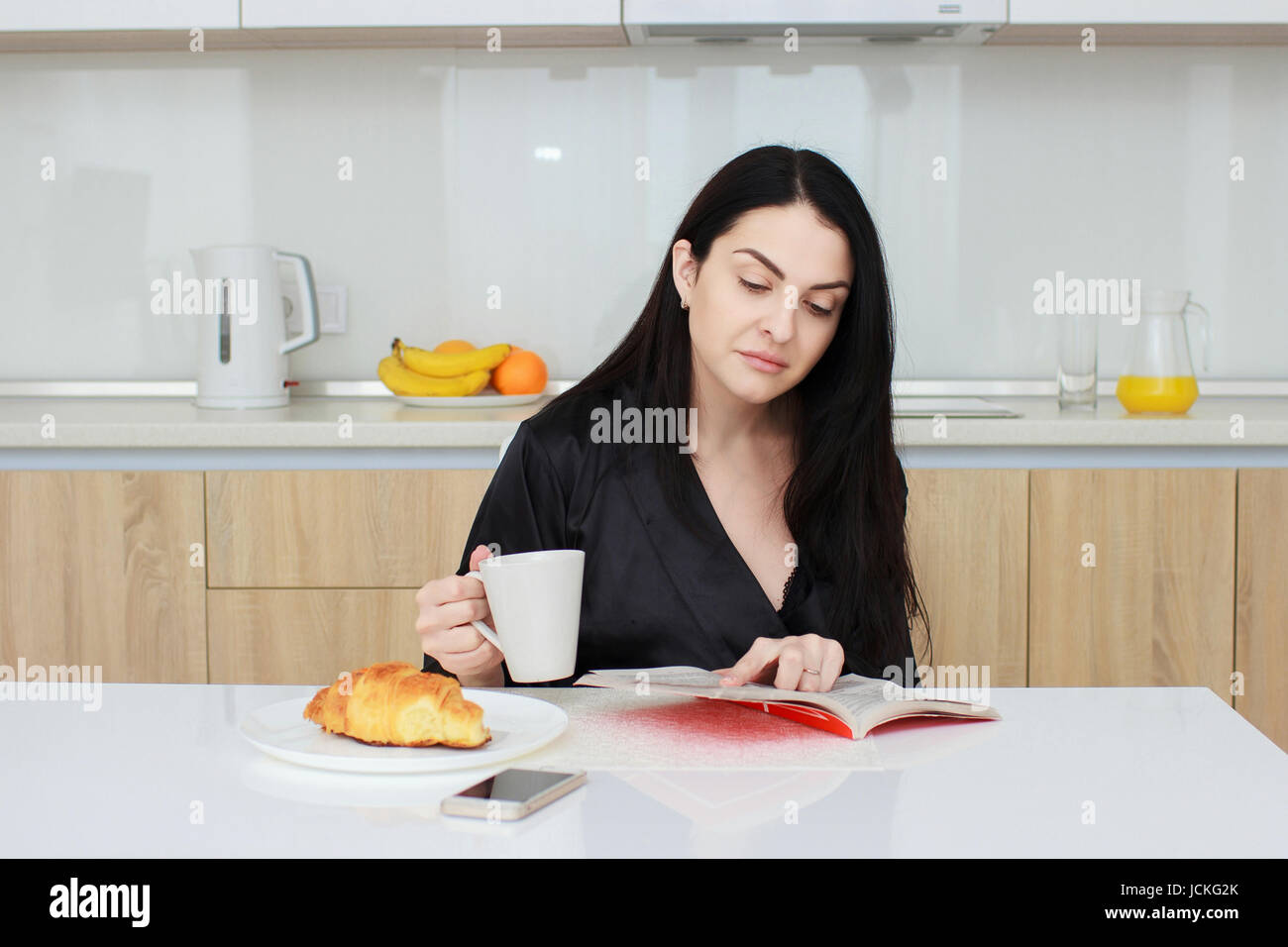 Positive mature woman reading book hi-res stock photography and images ...