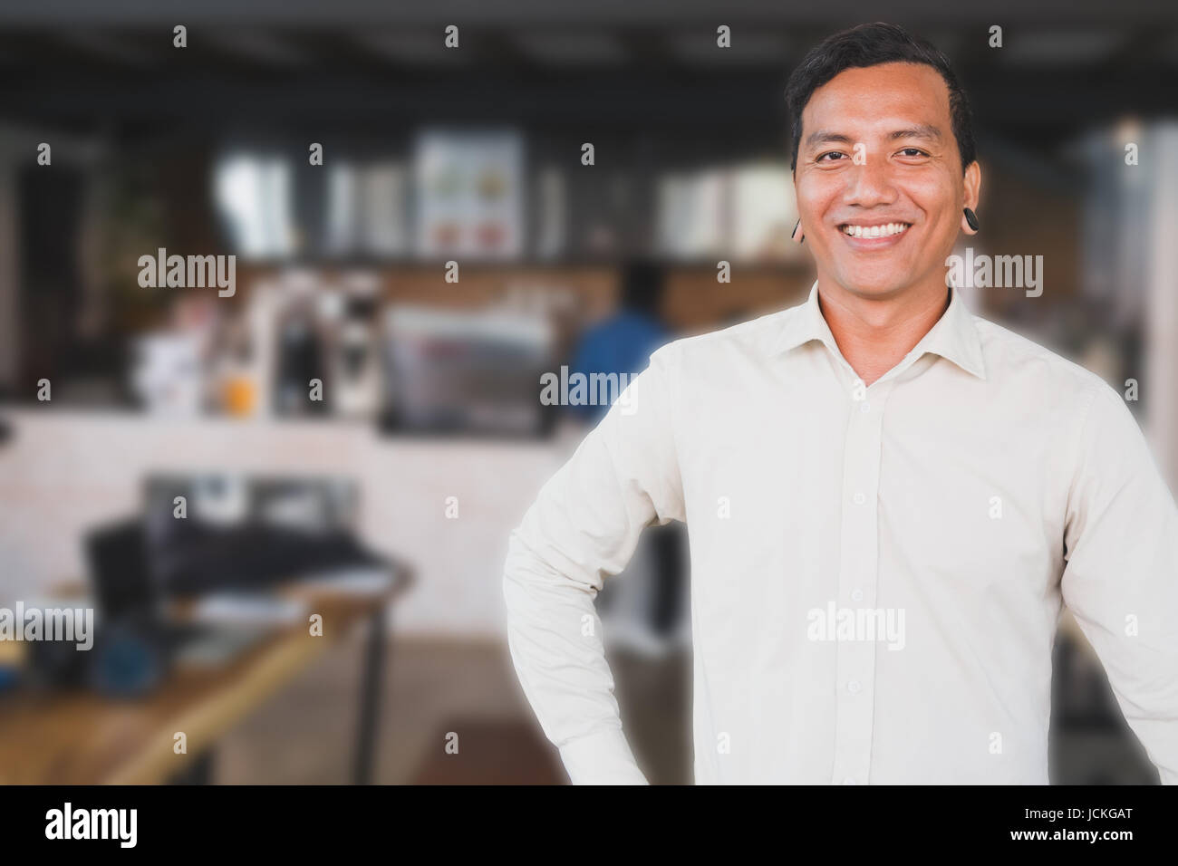 Successful small business owner standing at his cafe coffee shop. young ...