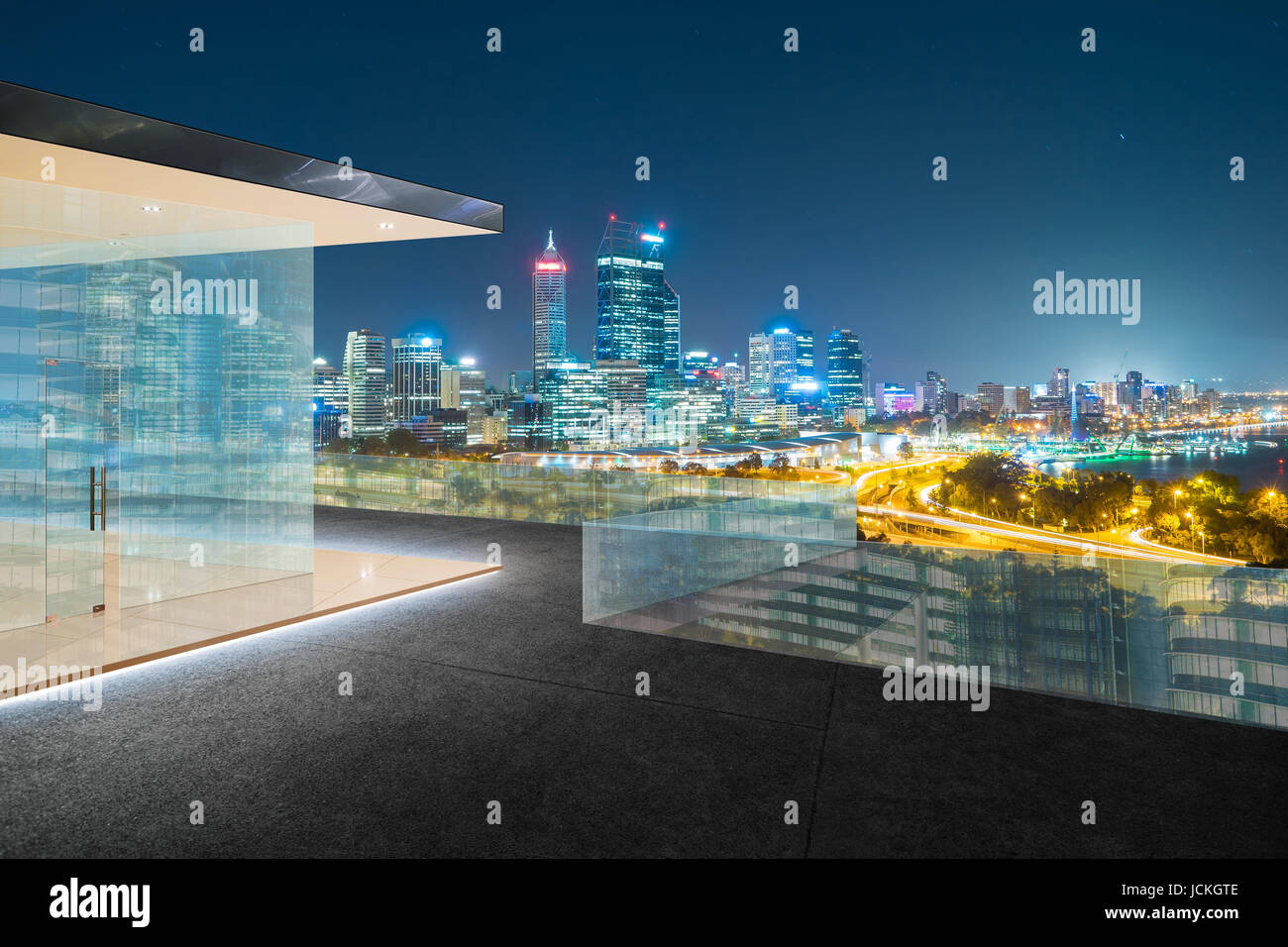 Modern city skyline at night with balcony view Stock Photo - Alamy