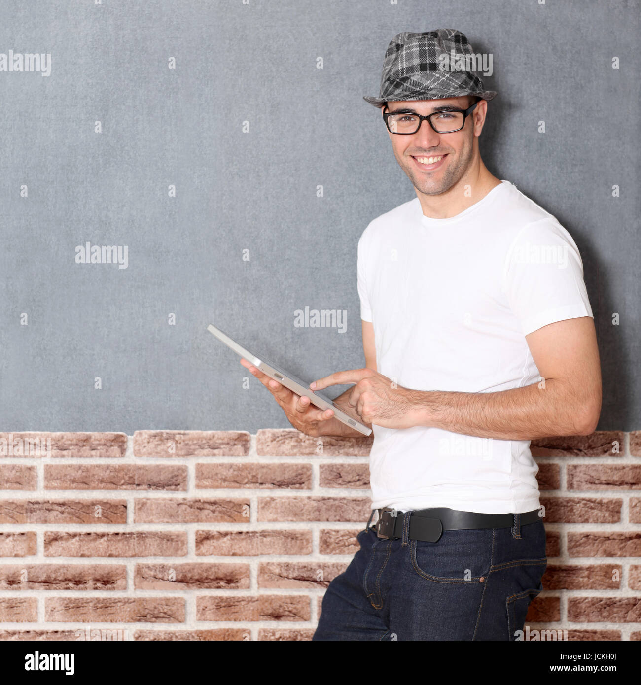 Stylish guy using electronic tablet Stock Photo - Alamy