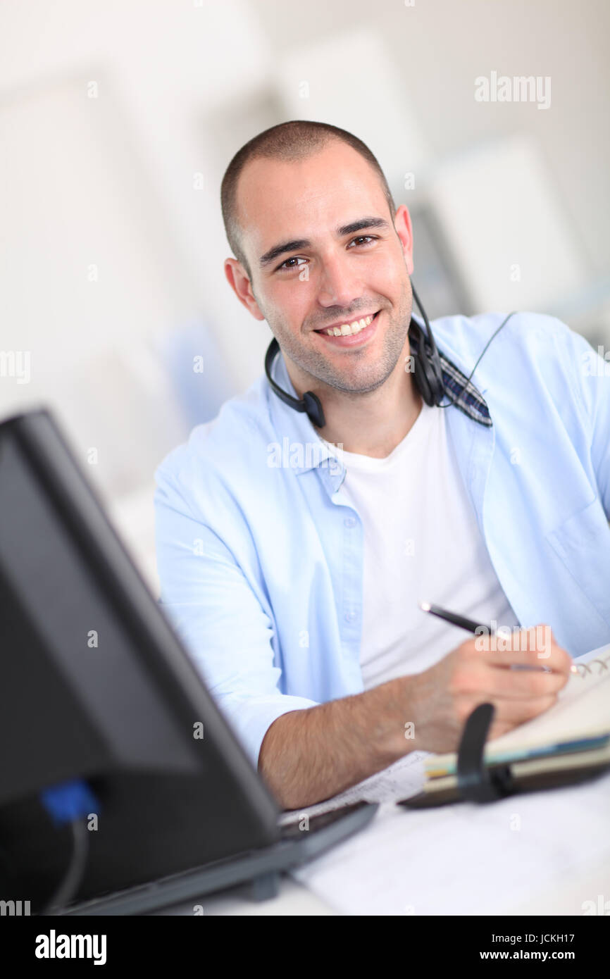 Portrait of cheerful customer service employee Stock Photo - Alamy