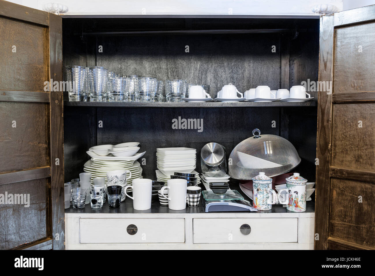kitchen cabinet with traditional utensils and tools Stock Photo - Alamy
