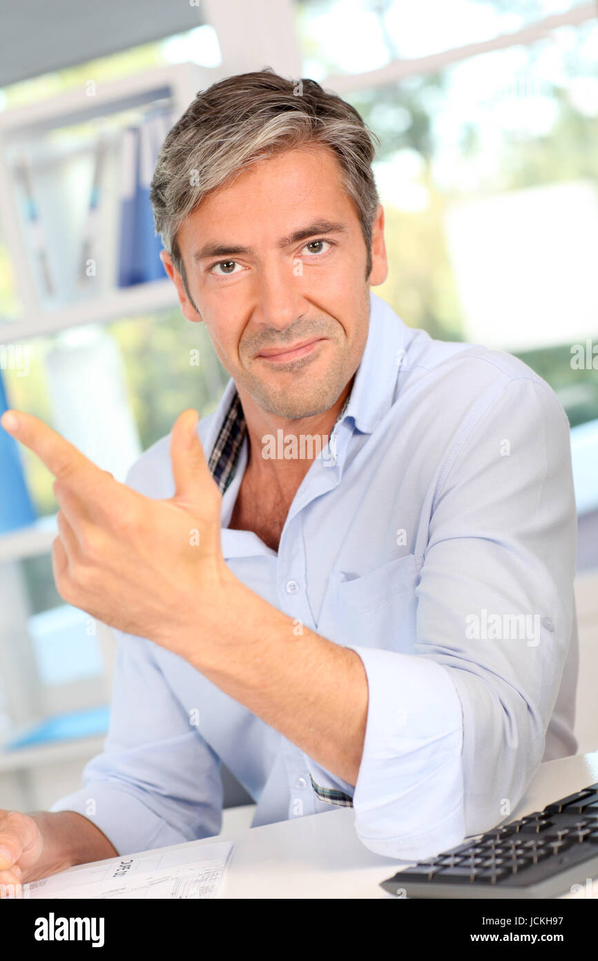Businessman giving arguments to client Stock Photo - Alamy
