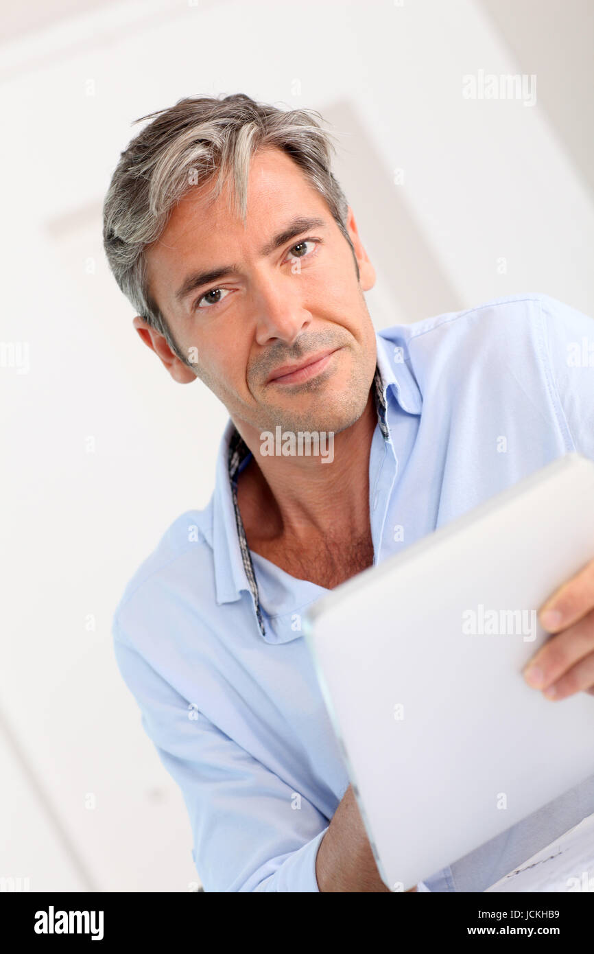 Office worker using electronic tablet Stock Photo - Alamy