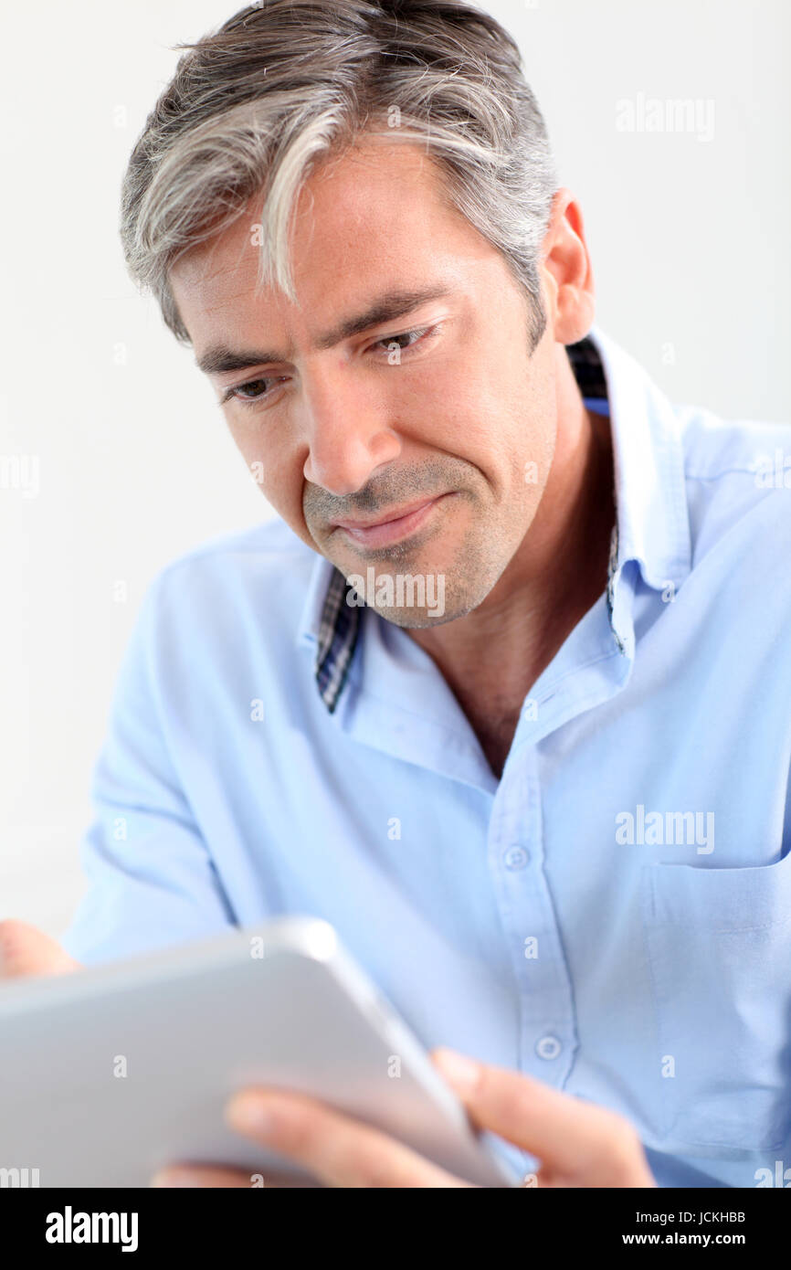 Office worker using electronic tablet Stock Photo - Alamy