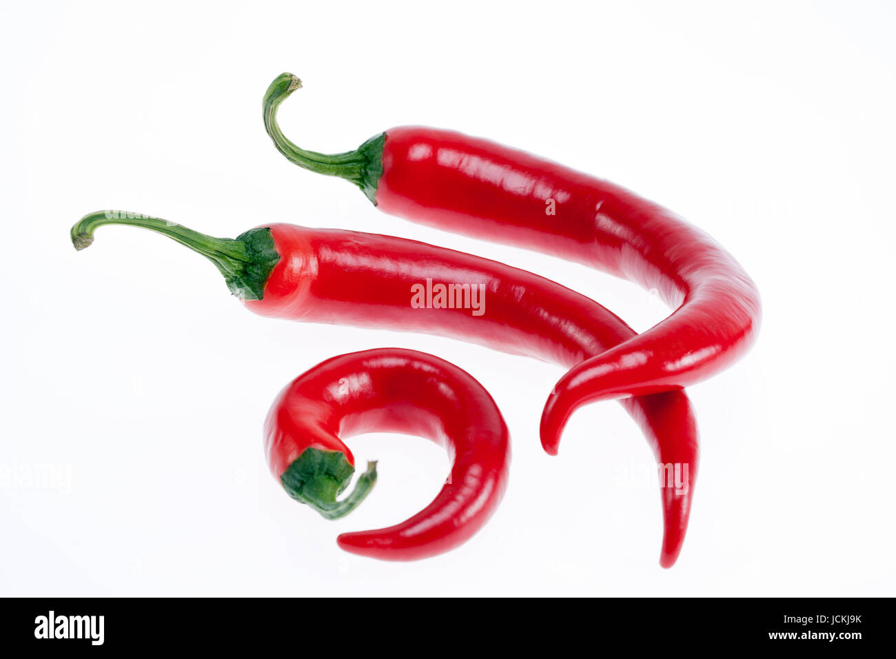 red peperoni peppers isolated on white background Stock Photo - Alamy