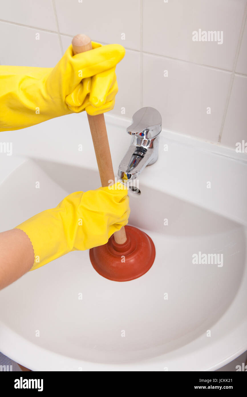 Close-up Of A Person's Hand Pressing Plunger In Sink Stock Photo - Alamy