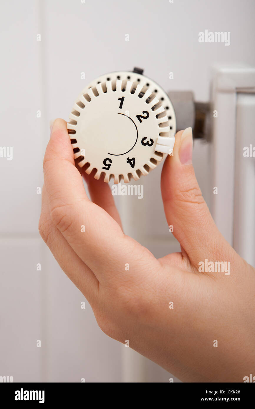 Close-up Of Person's Hand Adjusting Temperature By Thermostat Stock ...