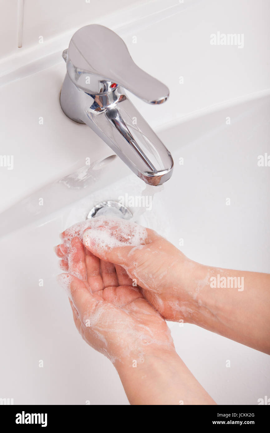 Close-up Of Person Washing Hand In Faucet With Soap Stock Photo - Alamy