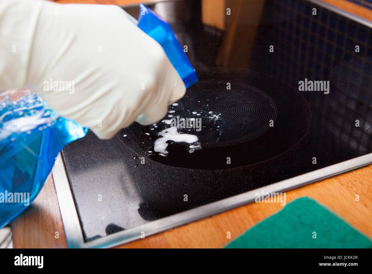 Induction cooktop hand hi-res stock photography and images - Alamy