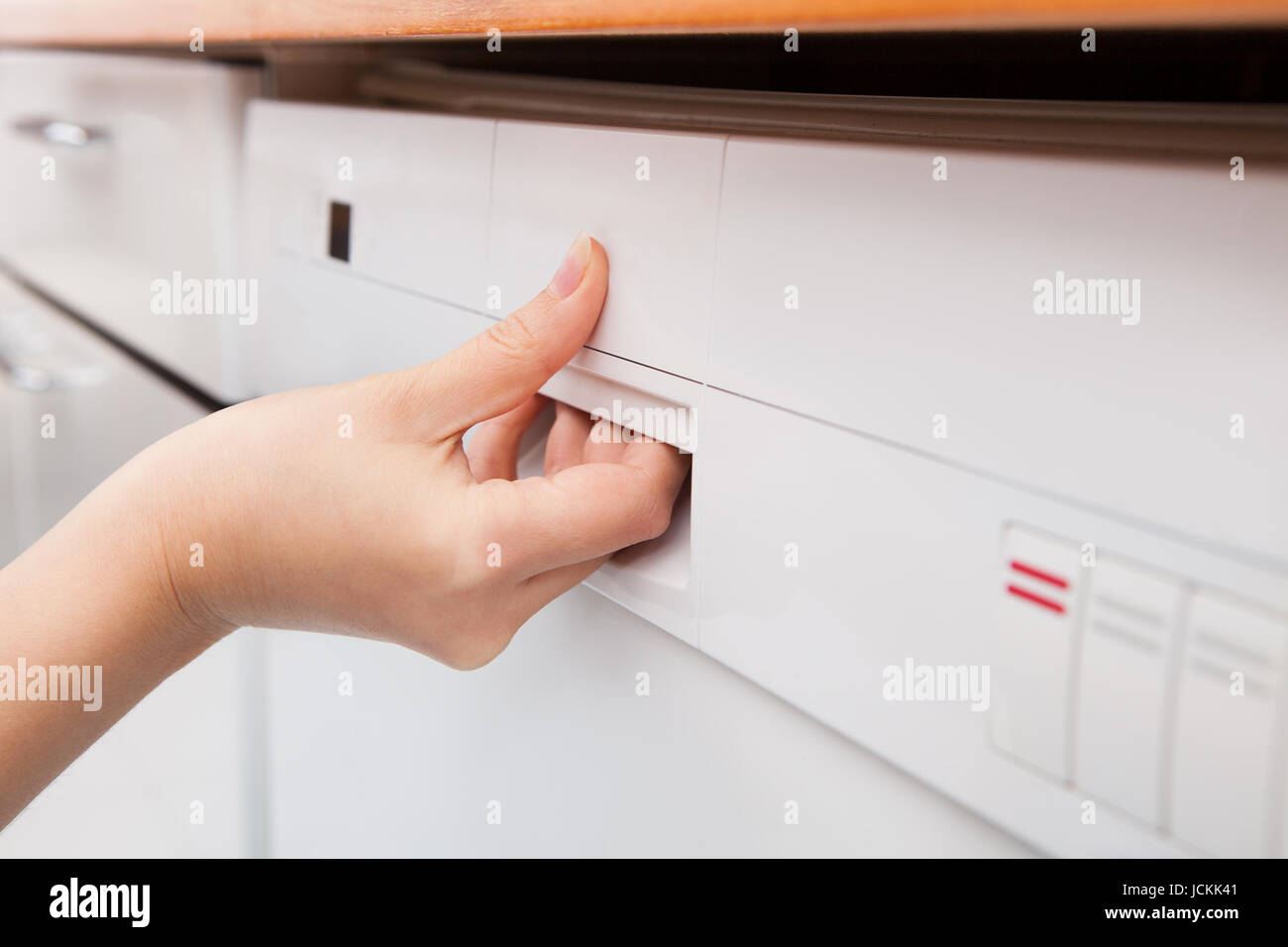 Close-up Photo Of Woman's Hand Opening Dishwasher Stock Photo - Alamy