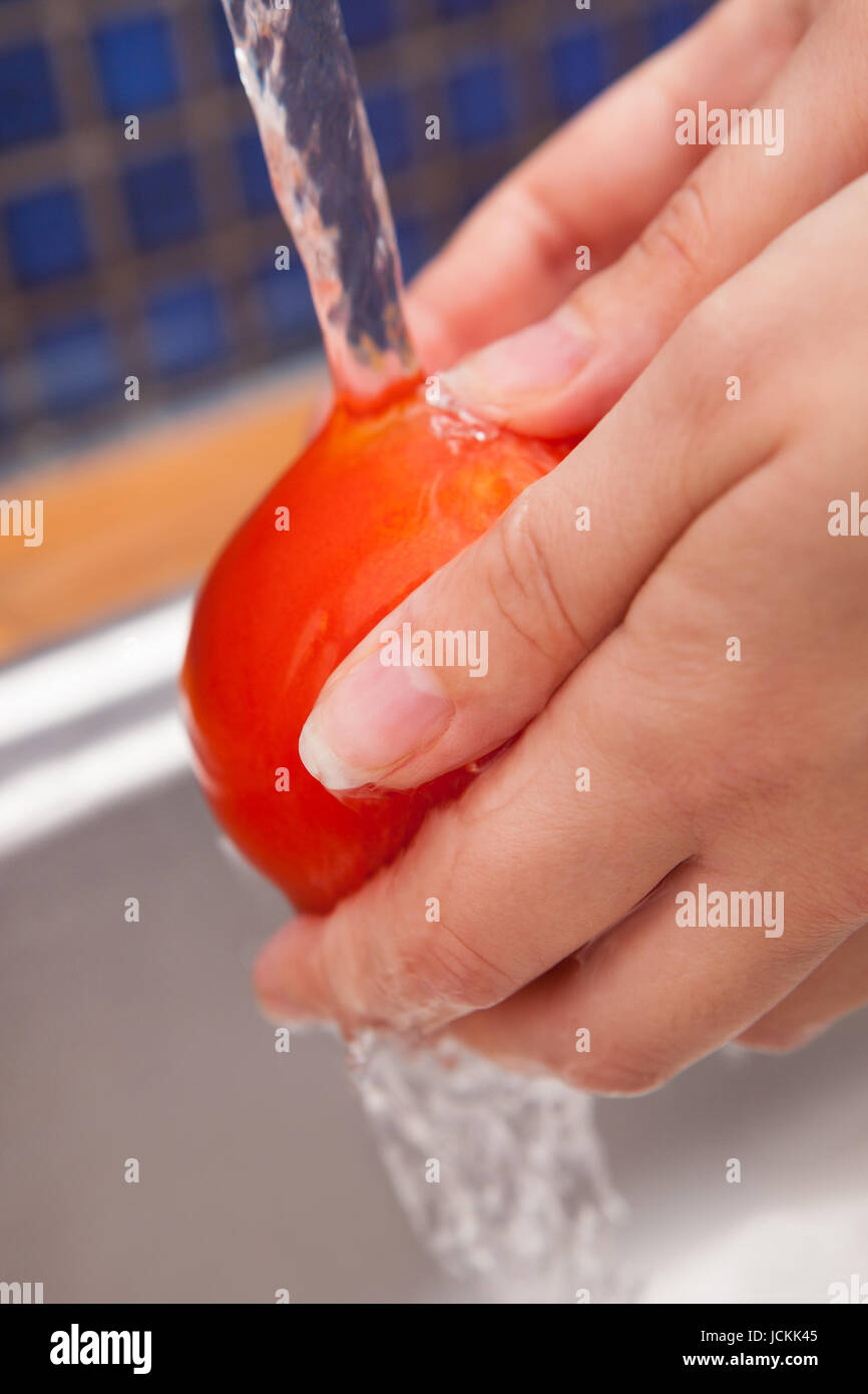 Washing tomato in running water hi-res stock photography and images - Alamy