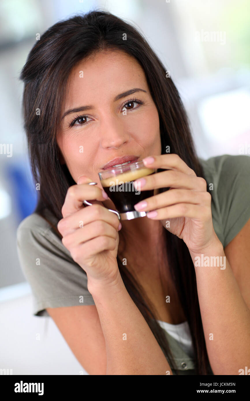 Portrait of beautiful woman drinking expresso Stock Photo - Alamy