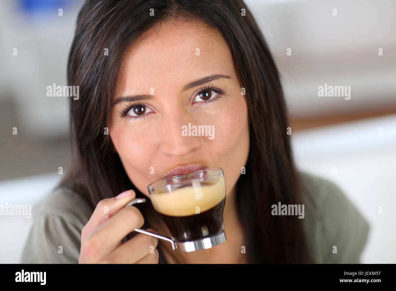 Portrait of beautiful woman drinking expresso Stock Photo - Alamy