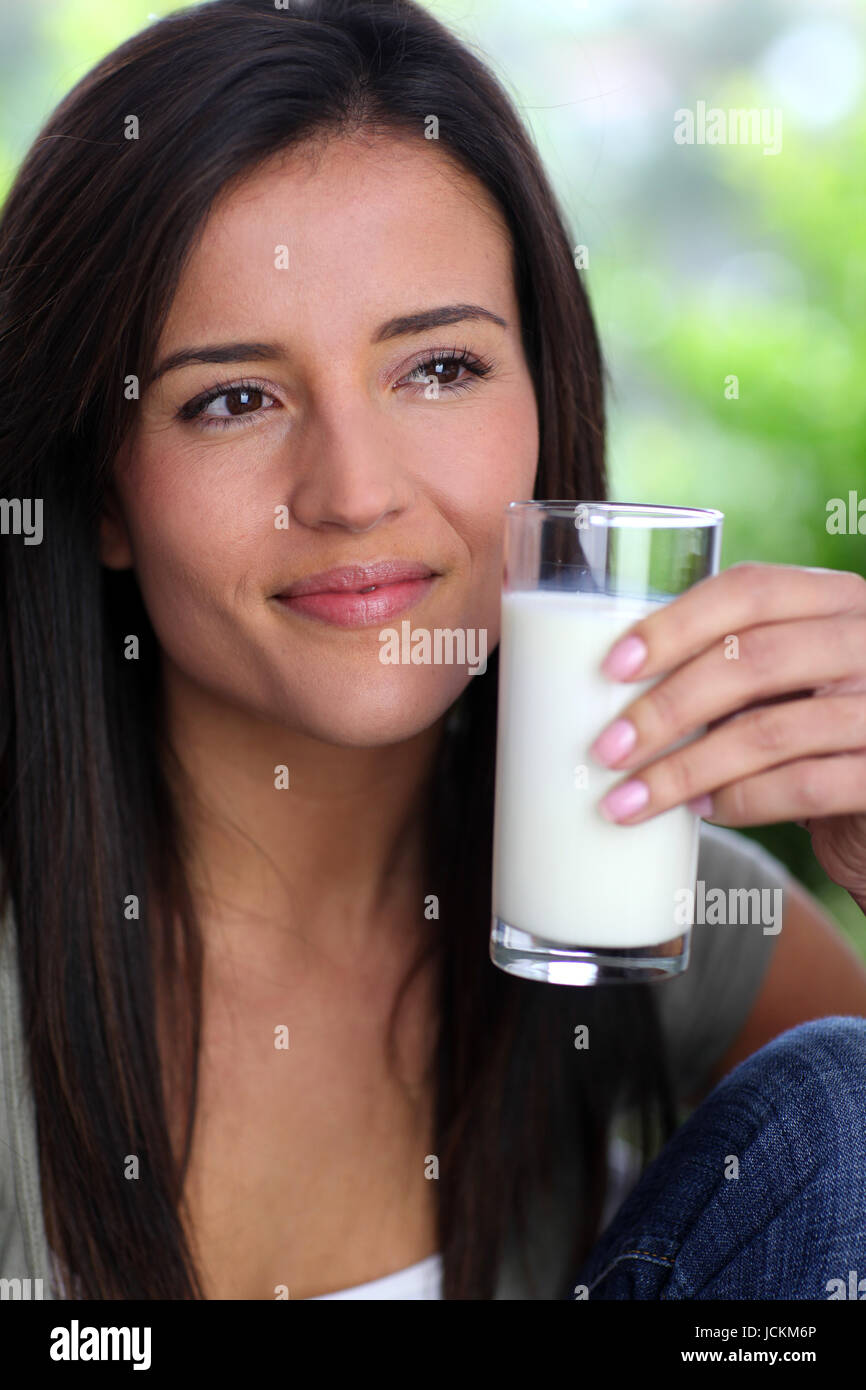 Smiling model drinking glass milk hi-res stock photography and images ...