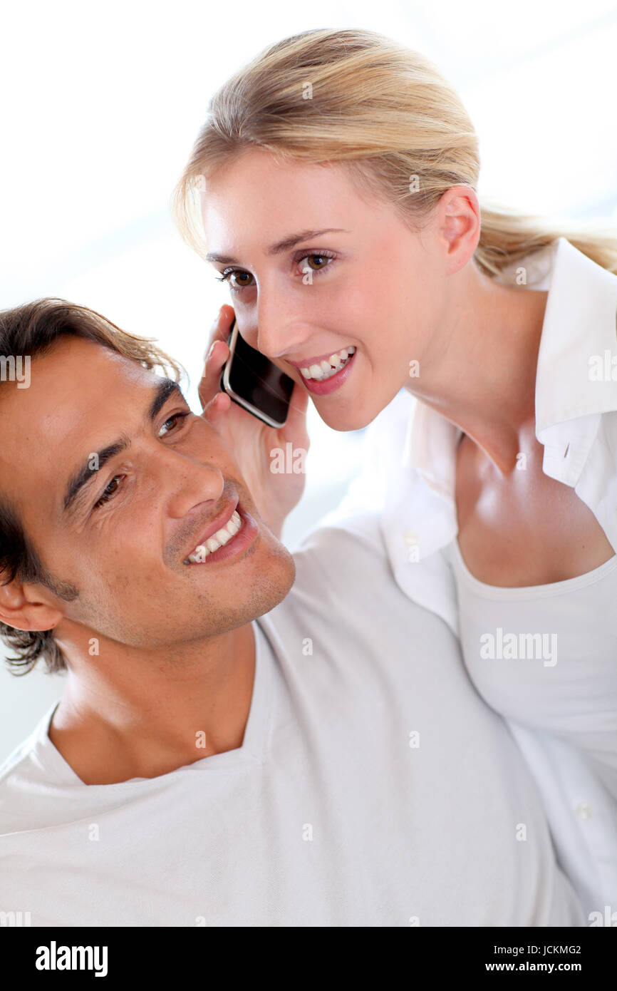 Couple receiving a phonecall Stock Photo - Alamy
