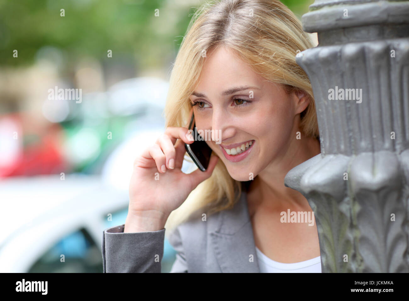 City girl talking on mobile phone in the street Stock Photo - Alamy
