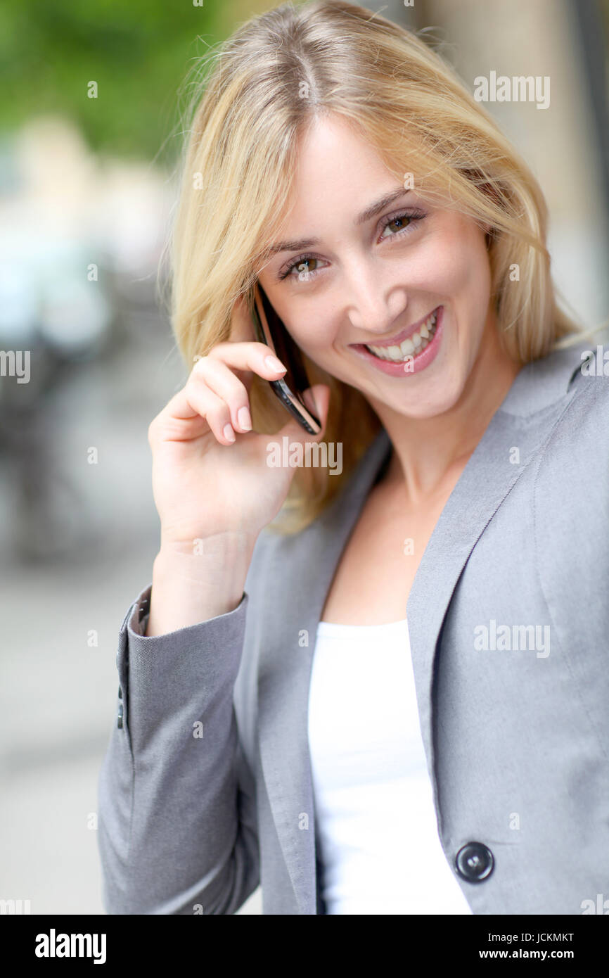 City girl talking on mobile phone in the street Stock Photo - Alamy