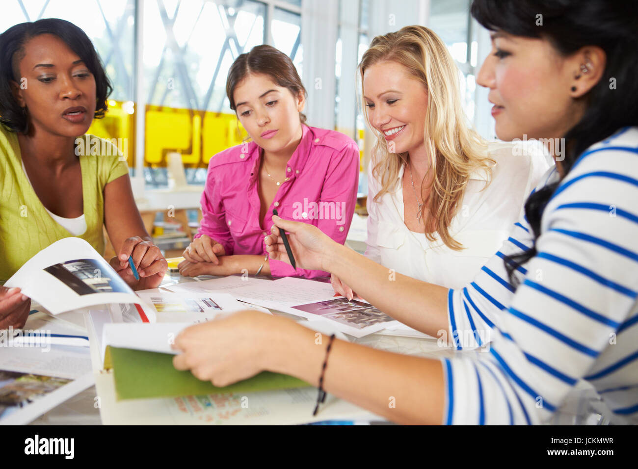 Group Of Women Meeting In Creative Office Stock Photo - Alamy