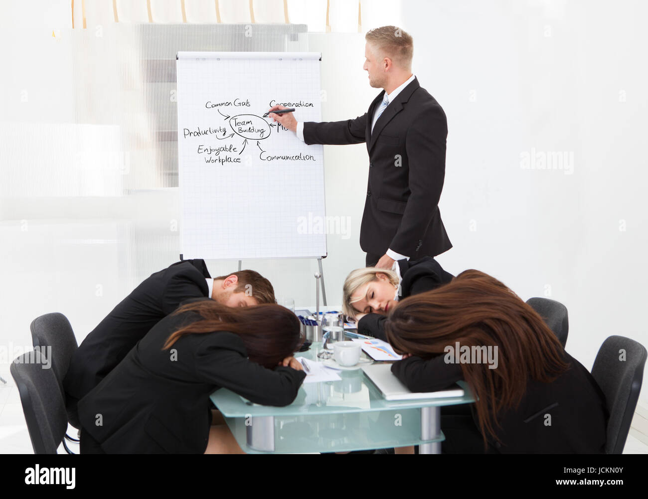 Businessman And His Colleagues Sleeping During Presentation Stock Photo ...